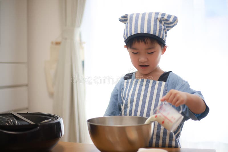 Boy making pancakes stock photo. Image of children, cooking - 248724608