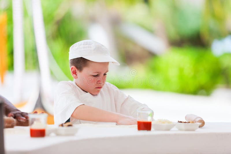 Boy making pizza stock photo. Image of expression, child - 43568168
