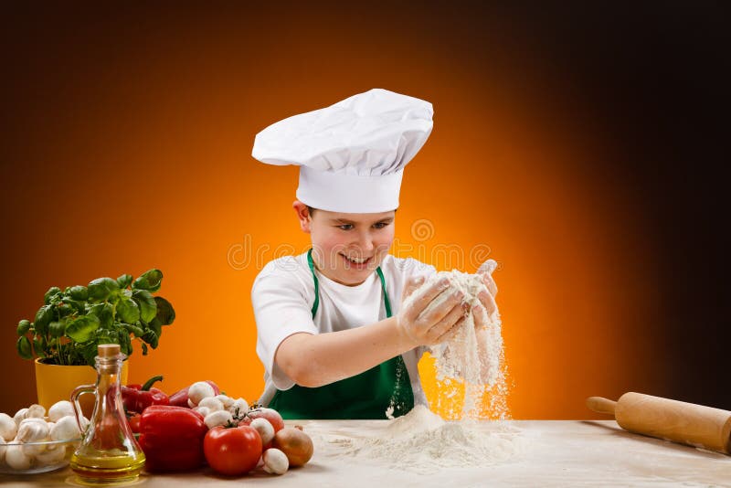 Boy making pizza dough stock image. Image of baker, flour - 59069805