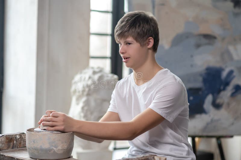 A Boy Making a Pot in an Art Studio Stock Photo - Image of pottery ...