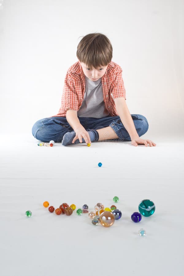 Boy Marble Play stock image. Image of isolated, child - 3761311