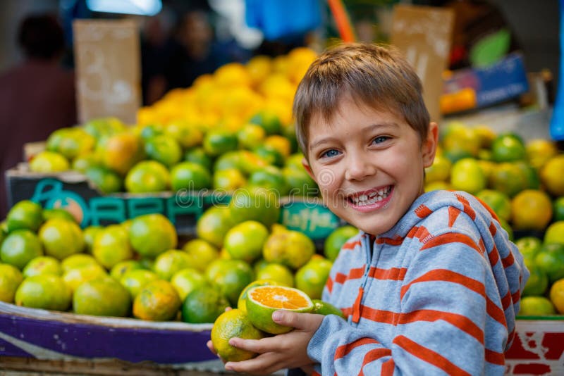 Boy on the market stock image. Image of market, fruit - 69781643