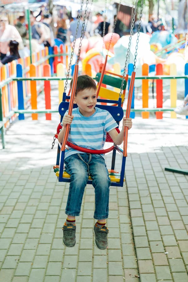 Boy Rides on a Merry-go-round Rides Children S Swing Stock Photo ...