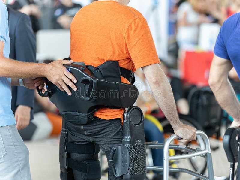 Boy with Mobility Problems in Lower Limbs in Upright Posture Walking ...