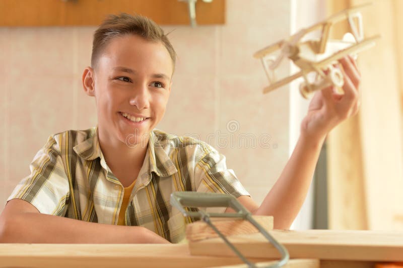 Boy with Model of Plane and Handsaw Stock Photo - Image of airplane ...