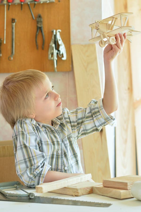 Boy with Model of Ship and Handsaw Stock Photo - Image of offspring ...