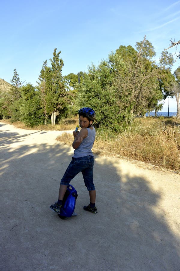 Boy on MonoWheel stock photo. Image of riding, park, child - 95340308