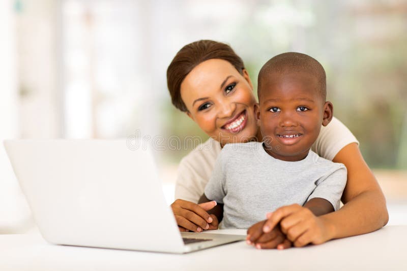Mother and son with laptop stock image. Image of excited - 6393167