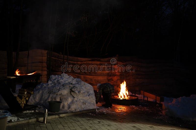 Boy Near by the Fire Pit in Winter Night Stock Image - Image of ...