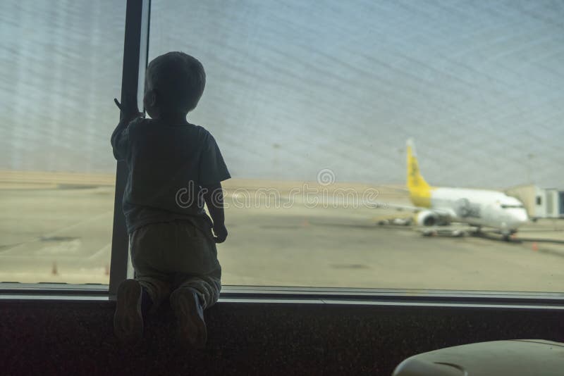 Boy Near the Window To the Airport Looking at the Plane Stock Image ...