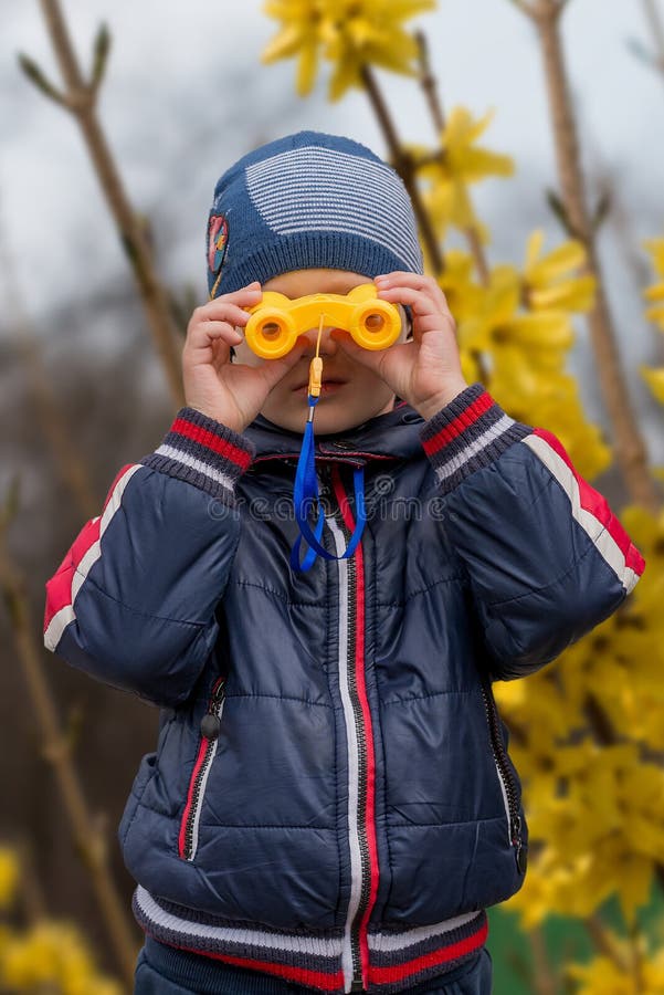 The Boy Observes in the Field-glass Stock Image - Image of blue, child ...