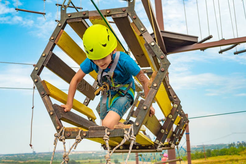 A Boy on an Obstacle Course Overcomes Difficulties with Moving in a ...