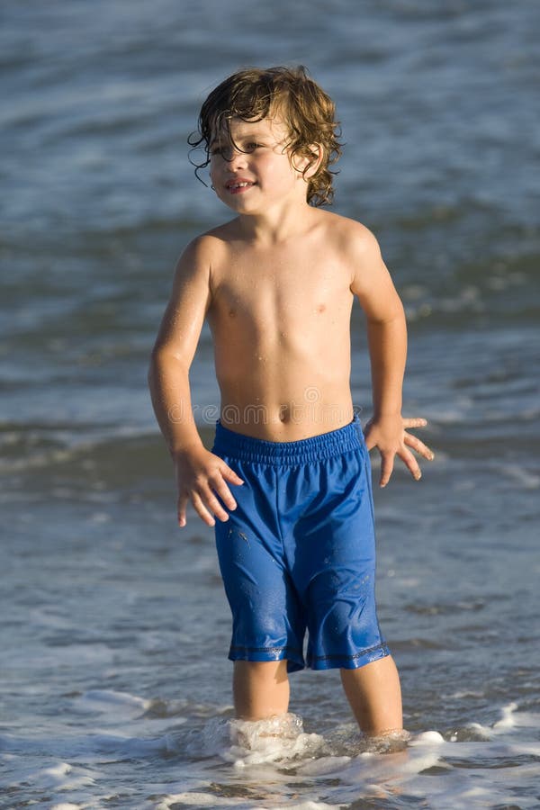 Boy in the ocean stock image. Image of vacations, sand - 10310247