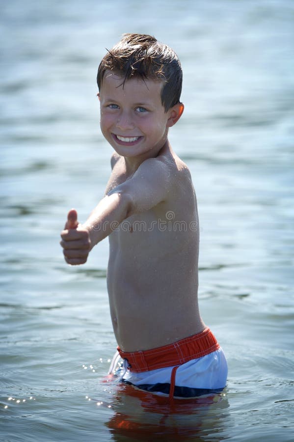 Boy in ocean stock photo. Image of blue, caucasian, beach - 15464250