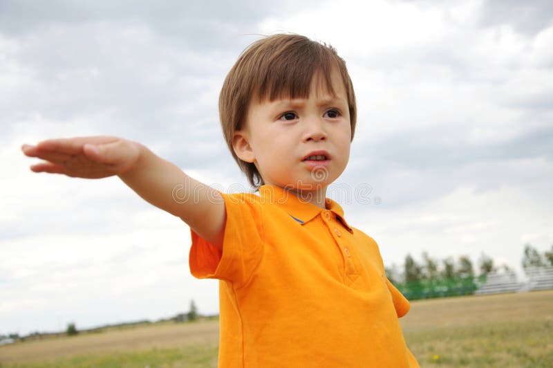 Boy with one hand up stock photo. Image of wake, stadium - 42701434