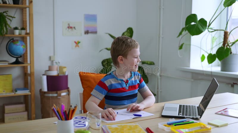 Boy Sit at Desk with Laptop and Smile, Portrait of Happy Child Spbas ...
