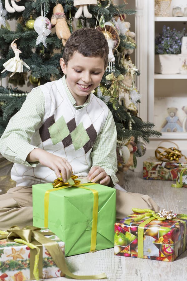 Boy is Opening Christmas Gifts Stock Image - Image of tree, celebration ...