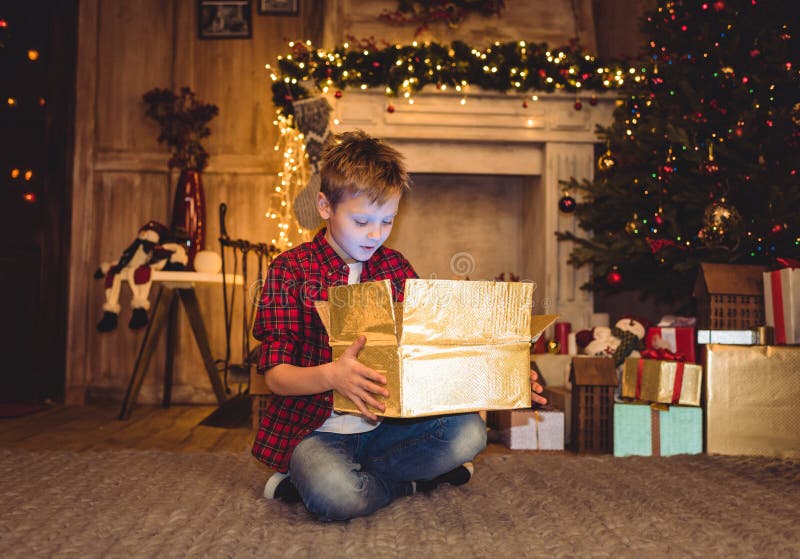 Boy Opening Christmas Present Stock Photo - Image of season, merry ...