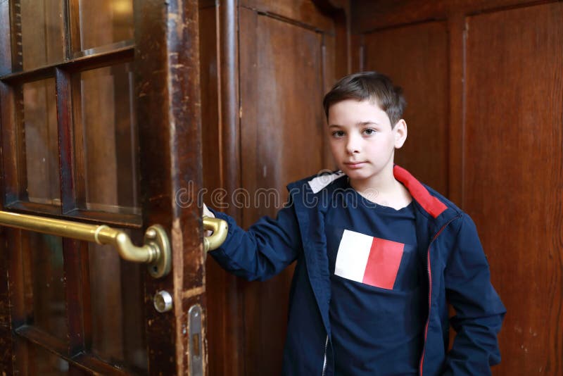 Boy Opening Old Wooden Door Stock Photo - Image of lock, concept: 250353834