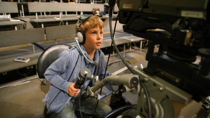 Boy Operating Stationary Camera in Big TV Studio Stock Footage - Video ...