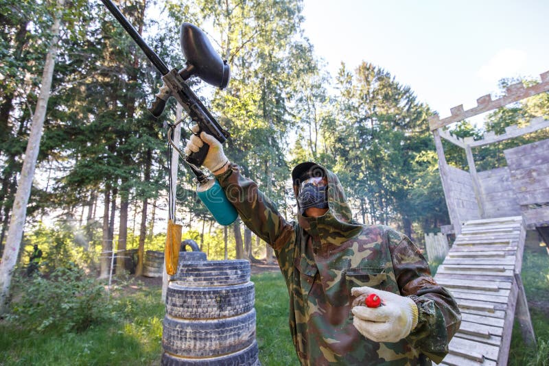 Boy with Paint Grenade Shooting from Paintball Marker Stock Image ...