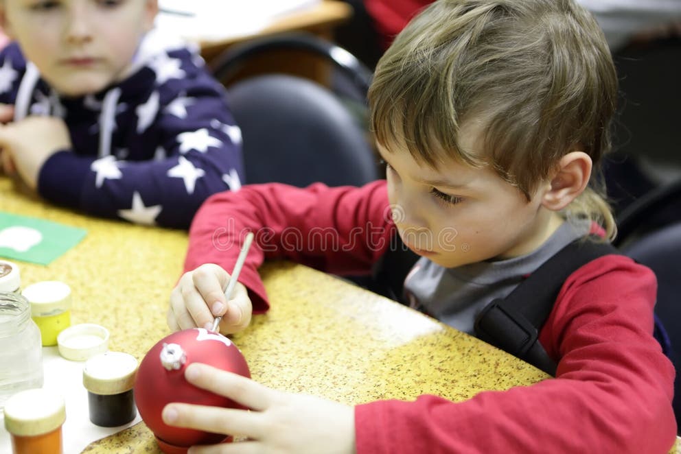 Boy Painting Christmas Ball Stock Photo - Image of paint, activity ...