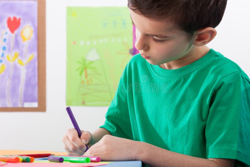 Boy paints on art lessons stock photo. Image of table - 42427856