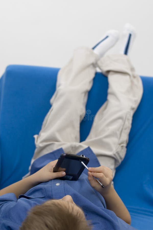 Boy / palmtop stock image. Image of hands, friends, happy - 286289