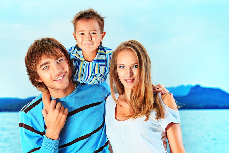 Boy with parents stock photo. Image of family, happiness - 28590108