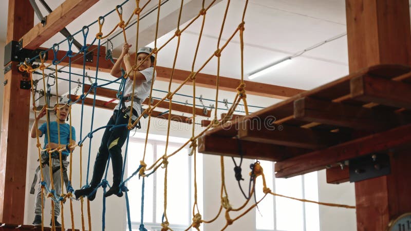 A Boy Passes the Obstacle Course of the Rope Park Stock Video - Video ...