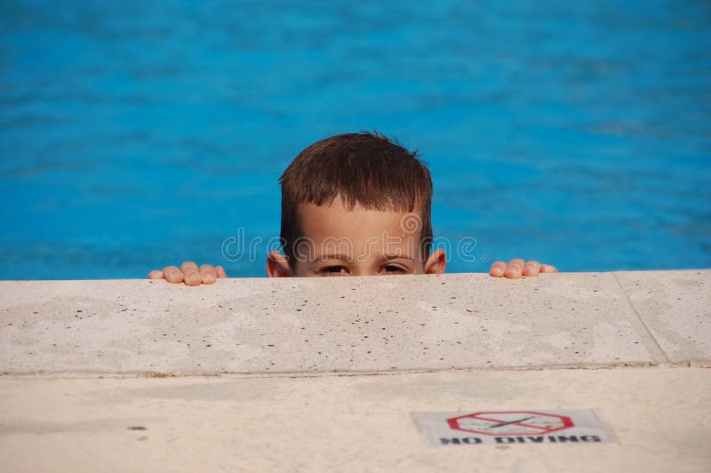 Boy peeking out of a pool stock image. Image of pool, summer - 8365193