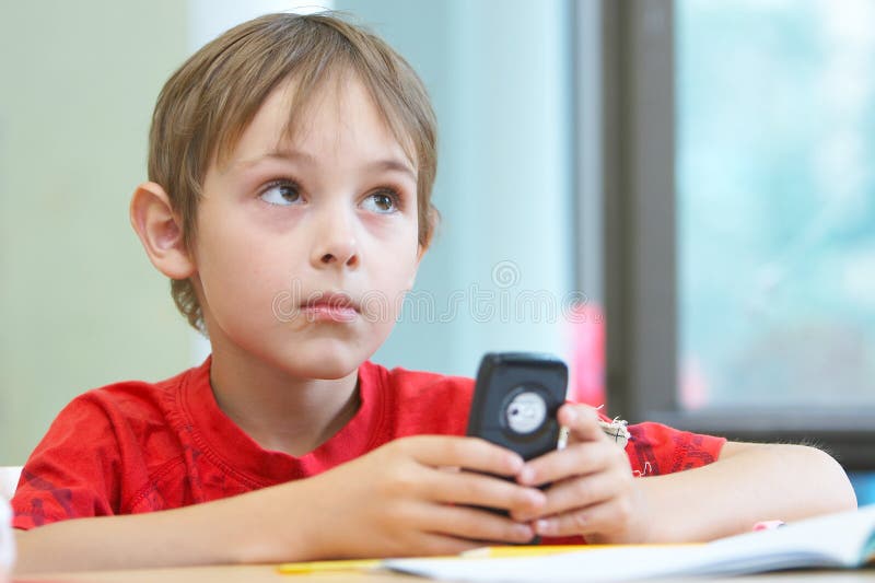 Boy with a phone stock image. Image of school, knowledge - 4462959