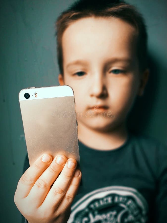 Boy with the phone stock photo. Image of holding, finger - 256907706