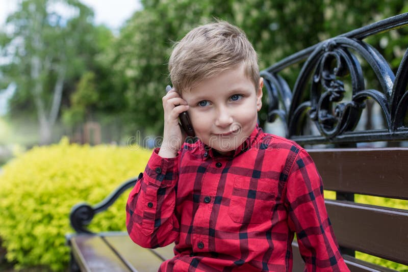 Boy with phone stock photo. Image of conversation, cellphone - 53906474