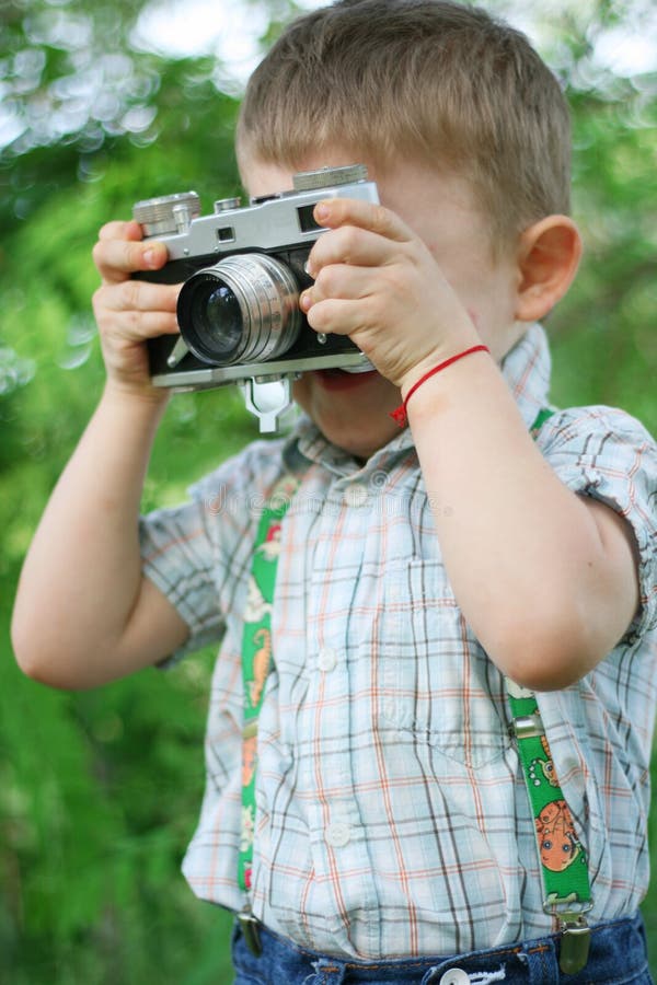 Boy photographer stock photo. Image of park, small, camera - 25530934