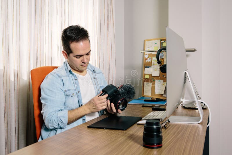 Boy Photographer Preparing His Camera while Working from Home on His ...