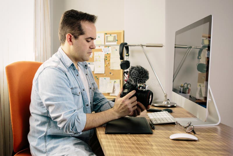Boy Photographer Preparing His Camera while Working from Home on His ...