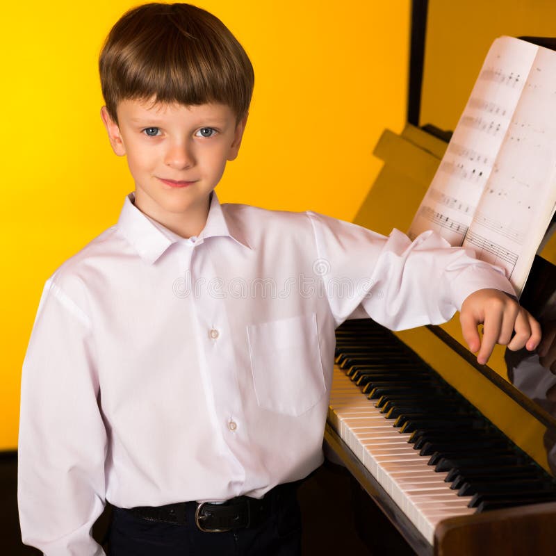 Boy piano. Piano player. stock photo. Image of ethnicity - 65479524