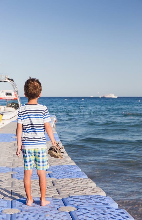 Boy on the pier stock image. Image of holiday, caucasian - 55106815