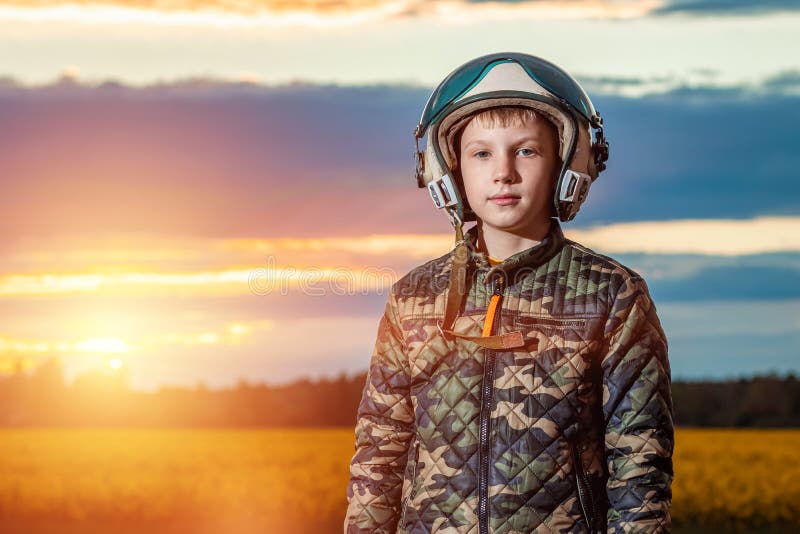 A Boy in a Pilot`s Helmet on a Sunset Background. Dream Concept, Choice ...