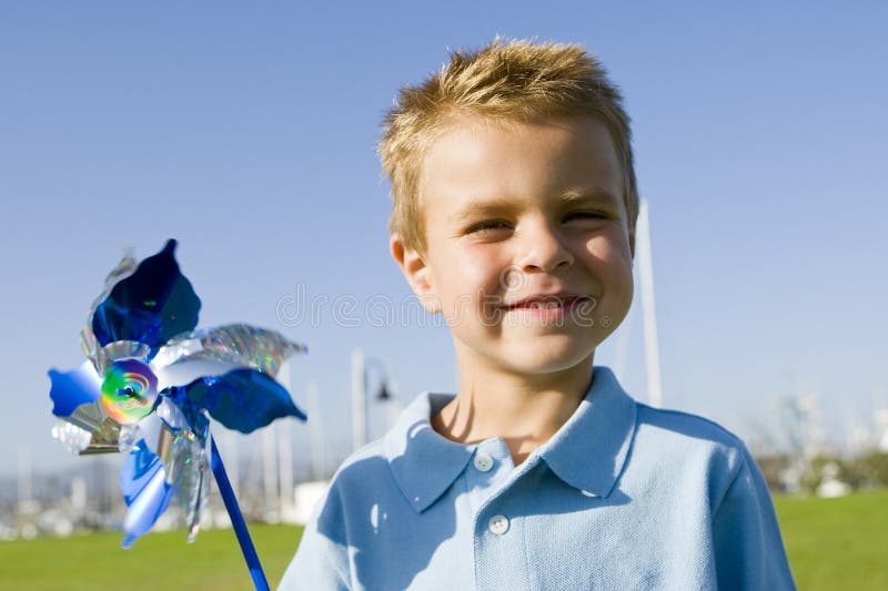 Boy pinwheel stock image. Image of childhood, play, happiness - 10732935