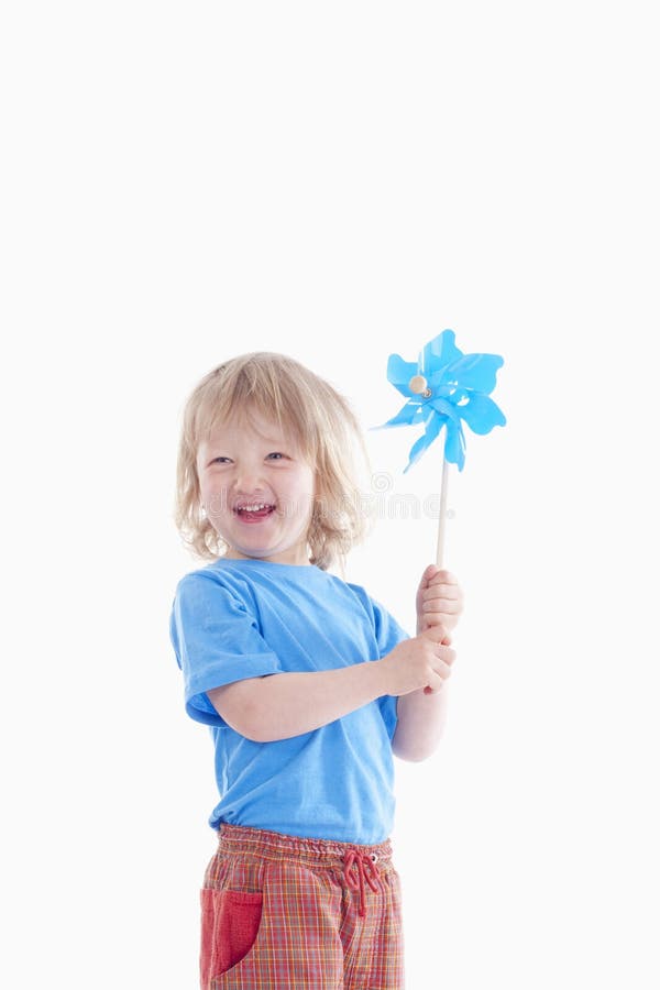 Boy with pinwheel stock image. Image of energy, blue - 14027489
