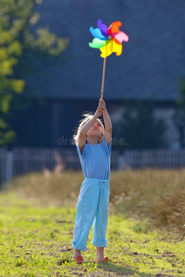 Boy with pinwheel stock photo. Image of nature, pinwheel - 20323942