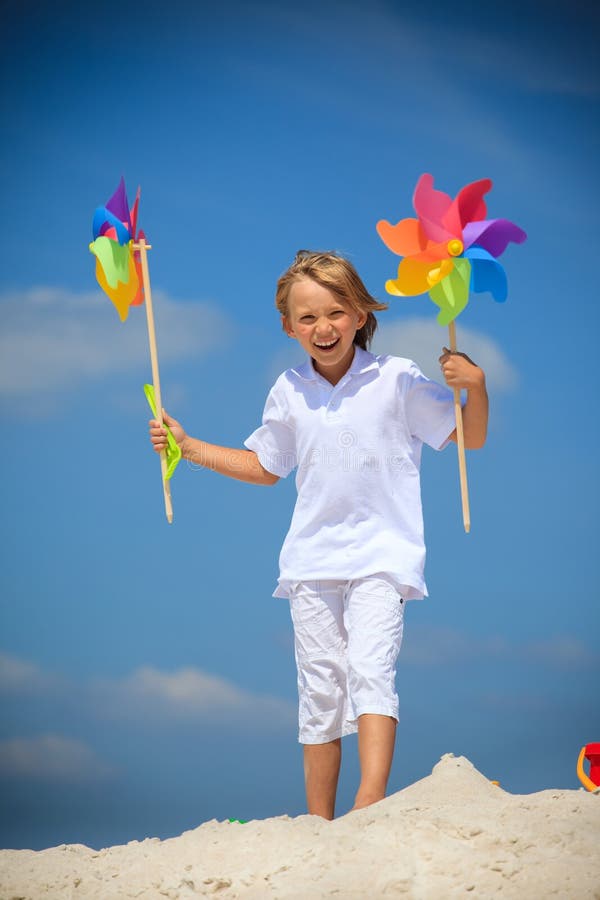 Boy with pinwheels stock photo. Image of smiles, little - 11448664