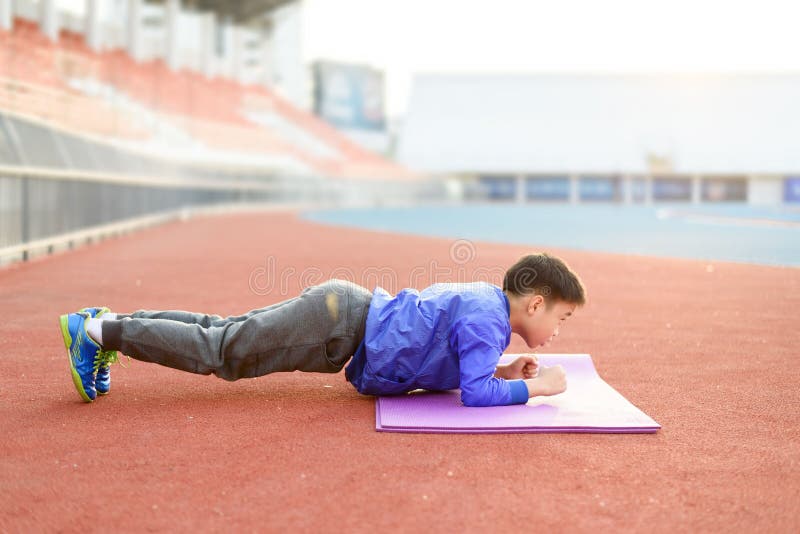 Boy plank stock photo. Image of blue, lifestyle, sport - 77419446