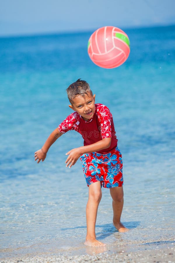 Boy play with a beach ball stock photo. Image of family - 69871190