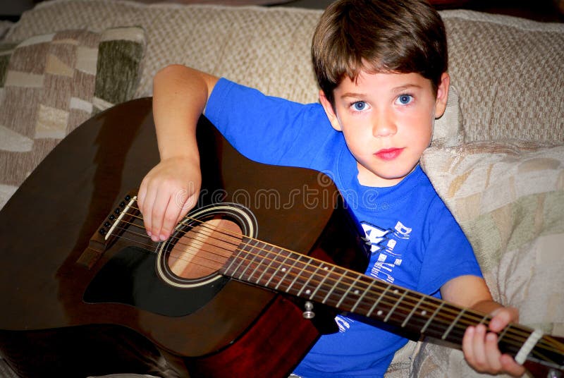 Boy play guitar stock photo. Image of blue, musical, guitarist - 2182082