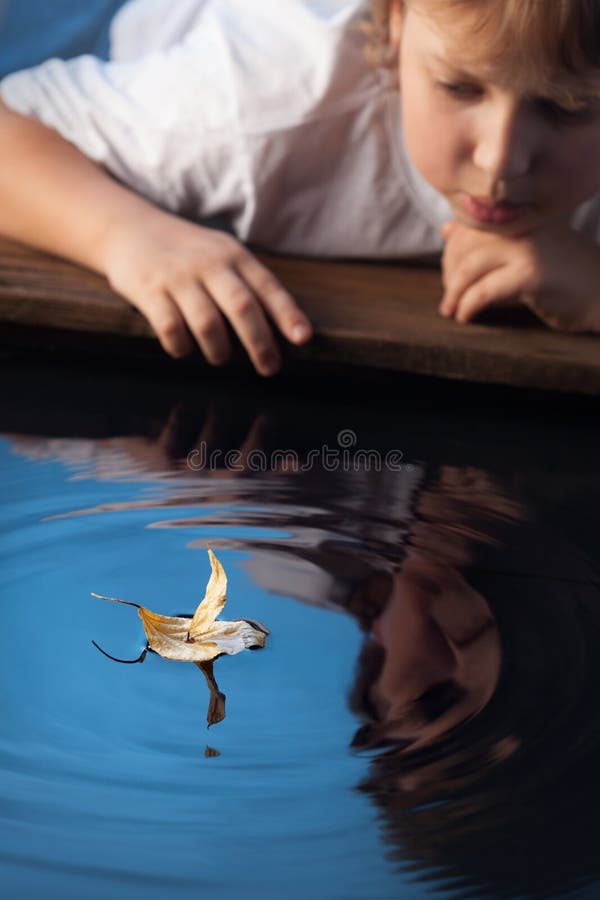 Boy Play with Leaf Ship in Water Stock Photo - Image of human, nature ...