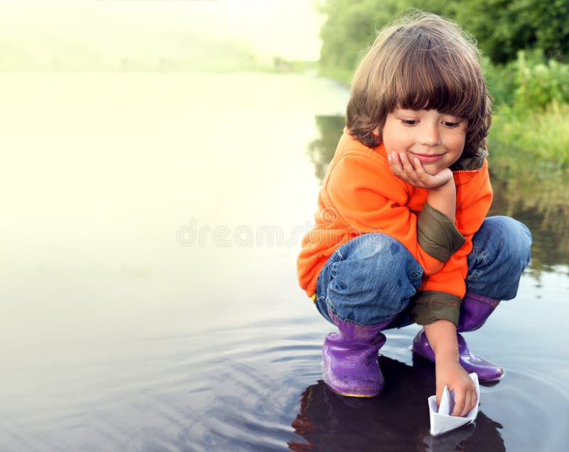 Two boy play in puddle stock photo. Image of caucasian - 136292942