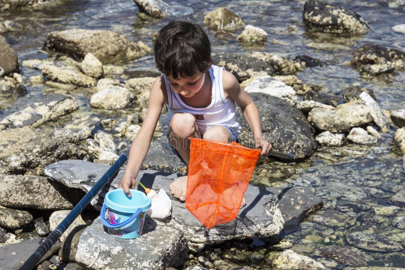 A boy play on the sea editorial stock photo. Image of leisure - 91317423